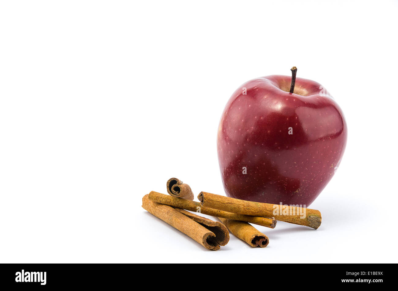 Beautiful red apple and cinnamon on isolated white background Stock ...
