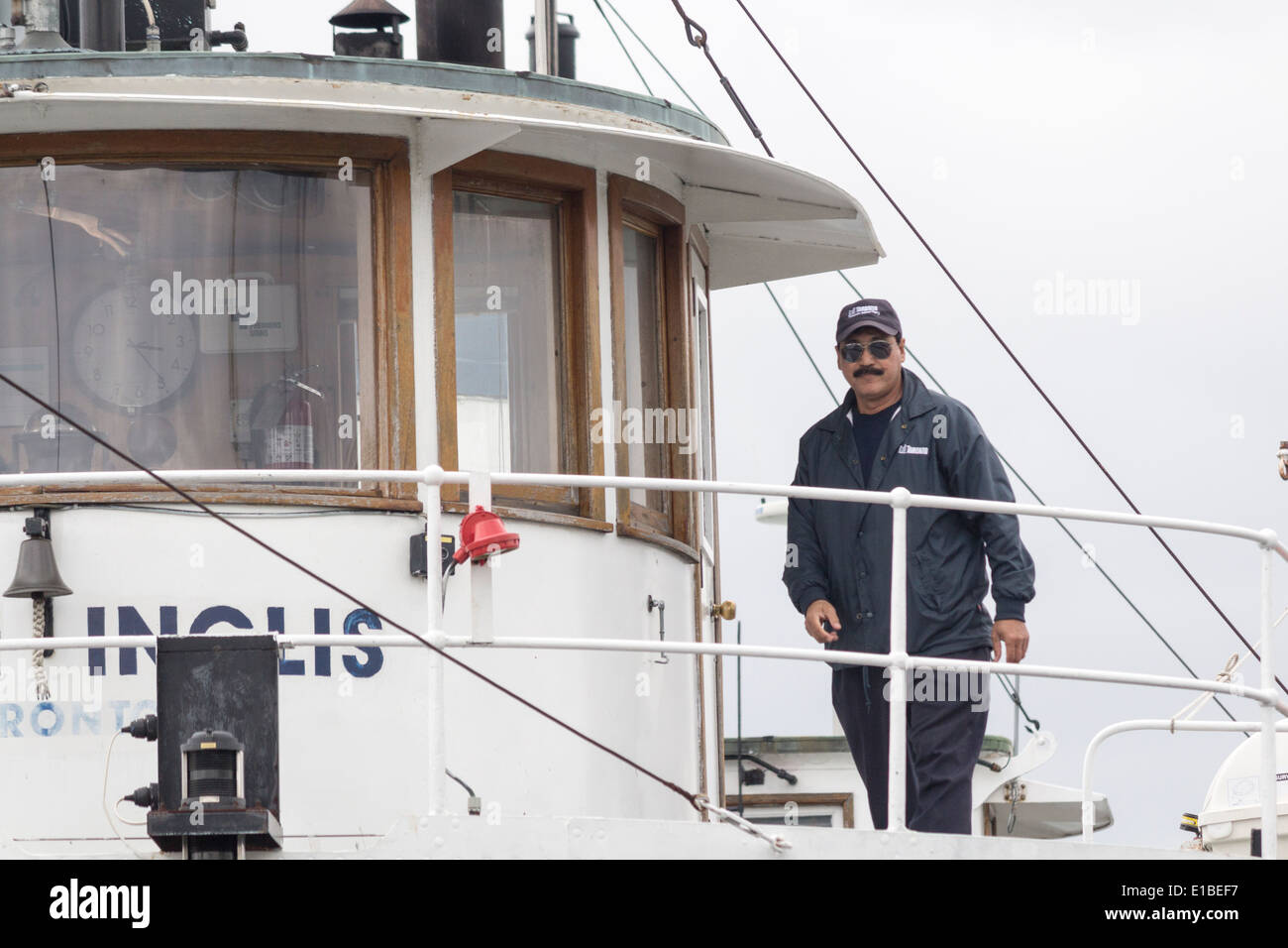 Ferry captain looking at the camera from one of the Toronto ferries ...
