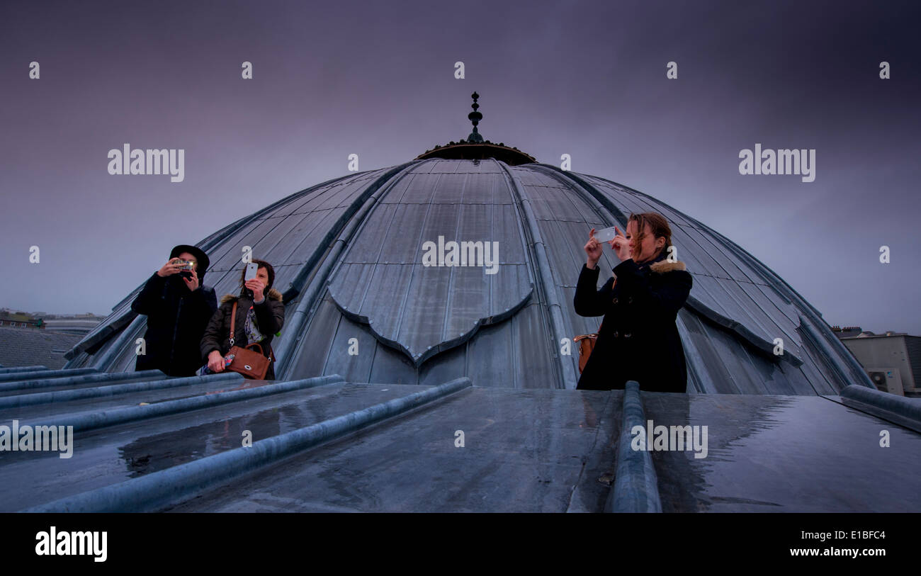 Visitors photographing the famous dome that tops the auditorium of The ...