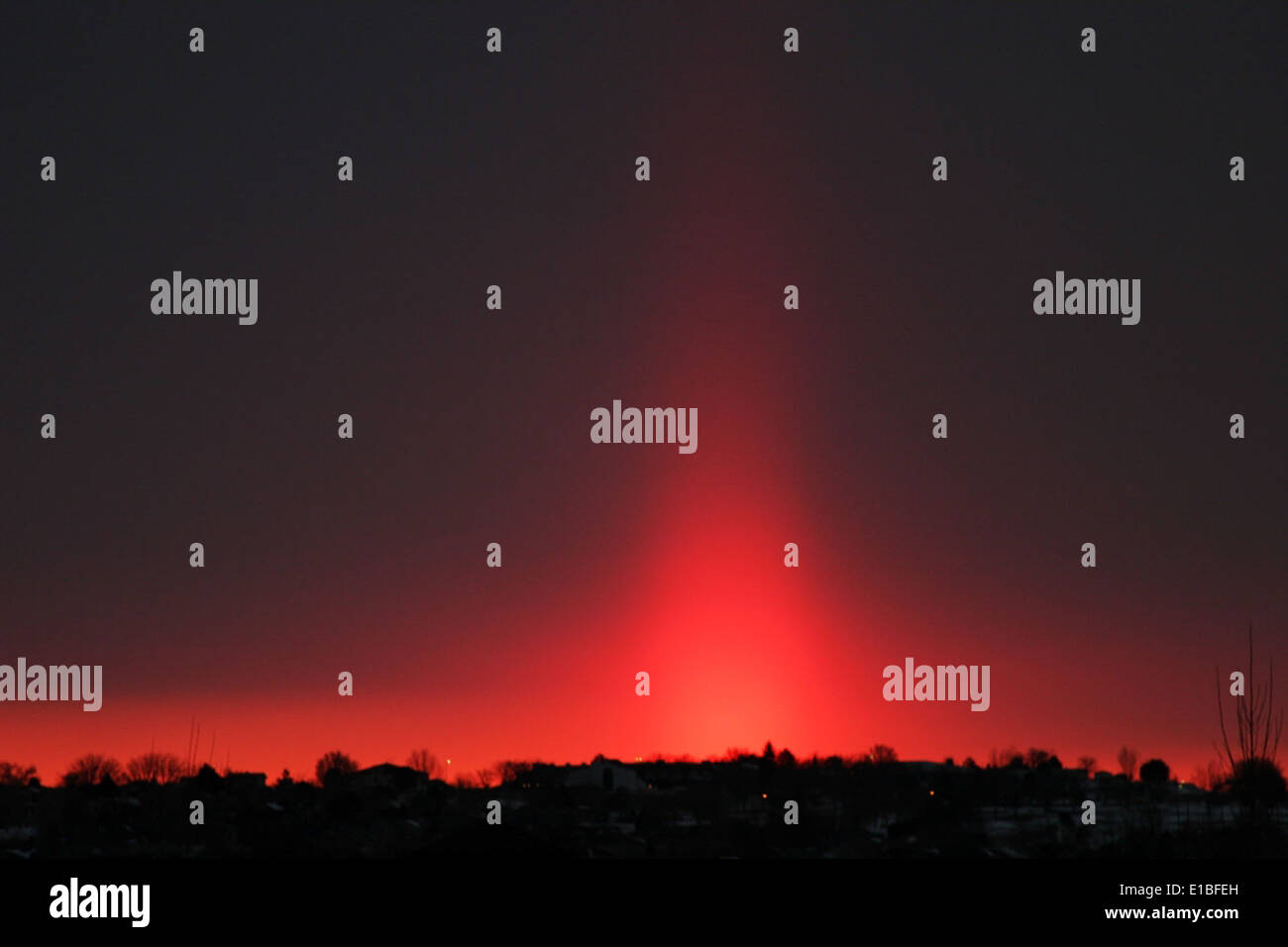 A tranquil spring sunrise over the landscape marks the beginning of a ...