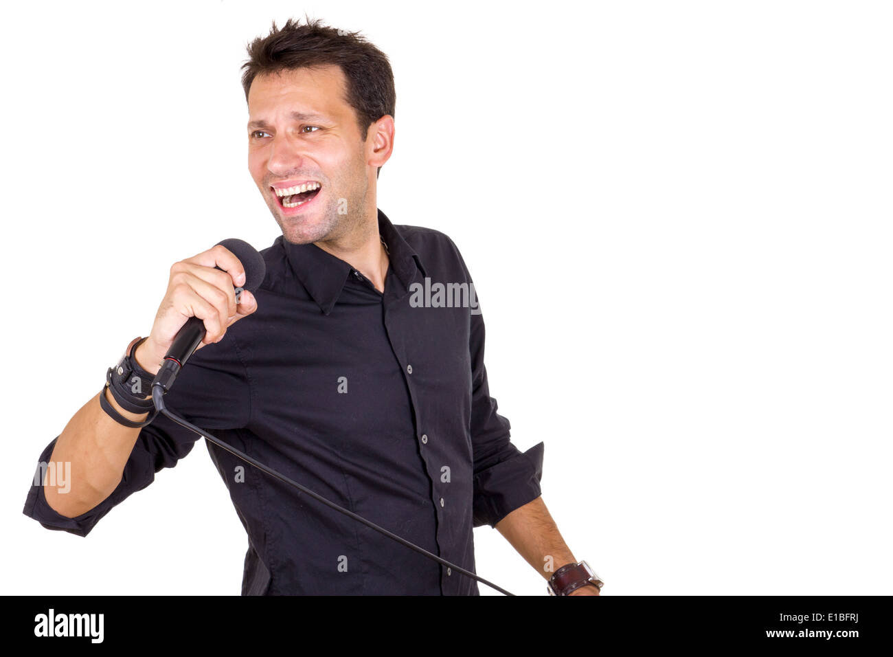 emotional male singer with microphone in hand Stock Photo - Alamy