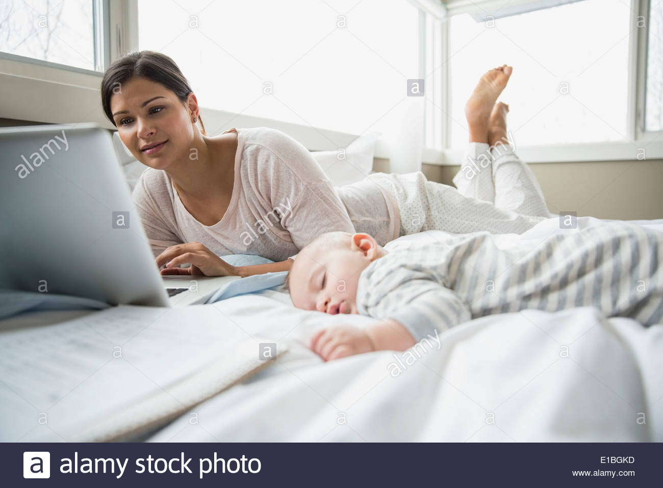Baby resting on mother hi-res stock photography and images - Alamy