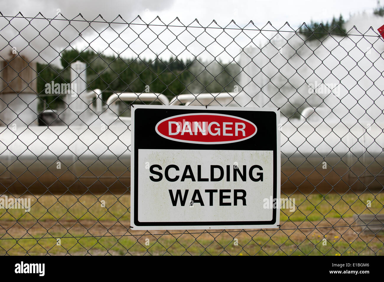 Danger notice on wire fence Scalding Water at geothermal power ...