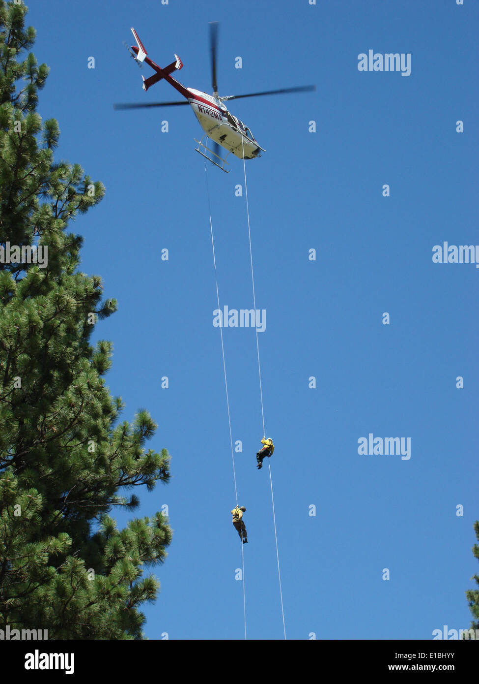 A helicopter rappel is used for rapid response in firefighting, rescue ...