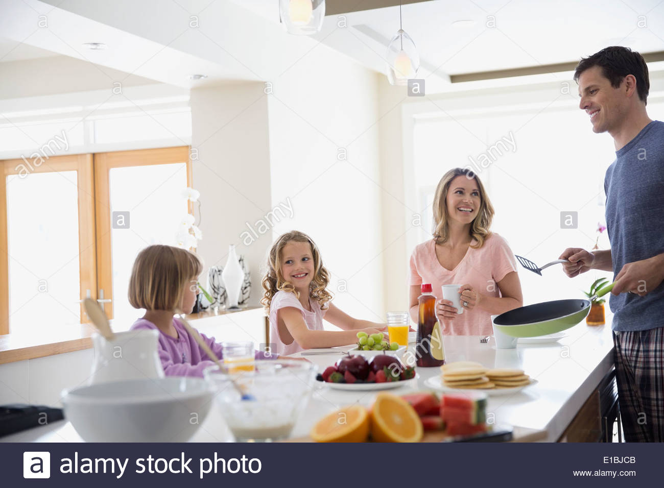 Family breakfast woman standing hi-res stock photography and images - Alamy