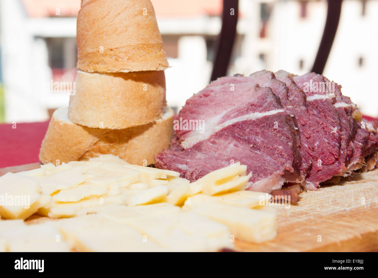 sliced bread and delicious homemade ham on the red table Stock Photo ...