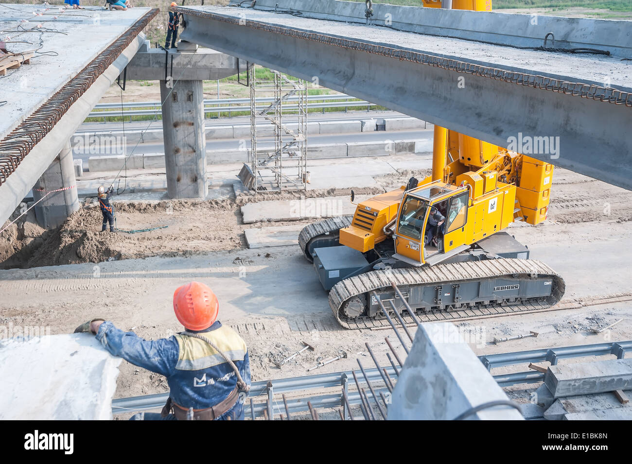 Workers levels provision of plate Stock Photo - Alamy