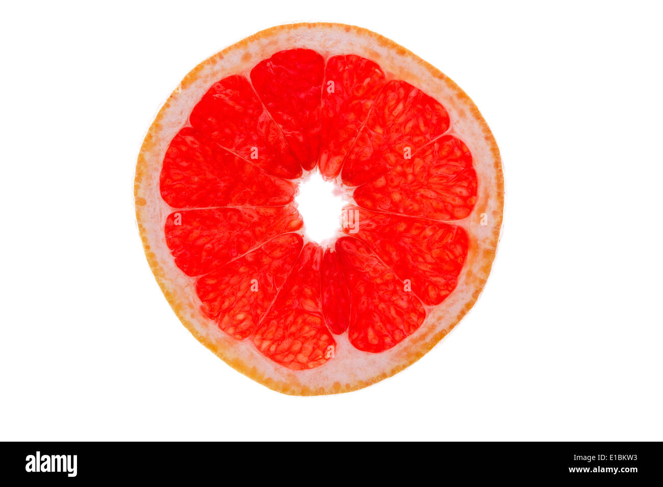 Colourful slice of ruby grapefruit isolated on white showing the ...