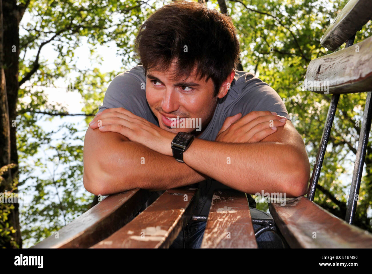 Leaning on a bench hi-res stock photography and images - Alamy