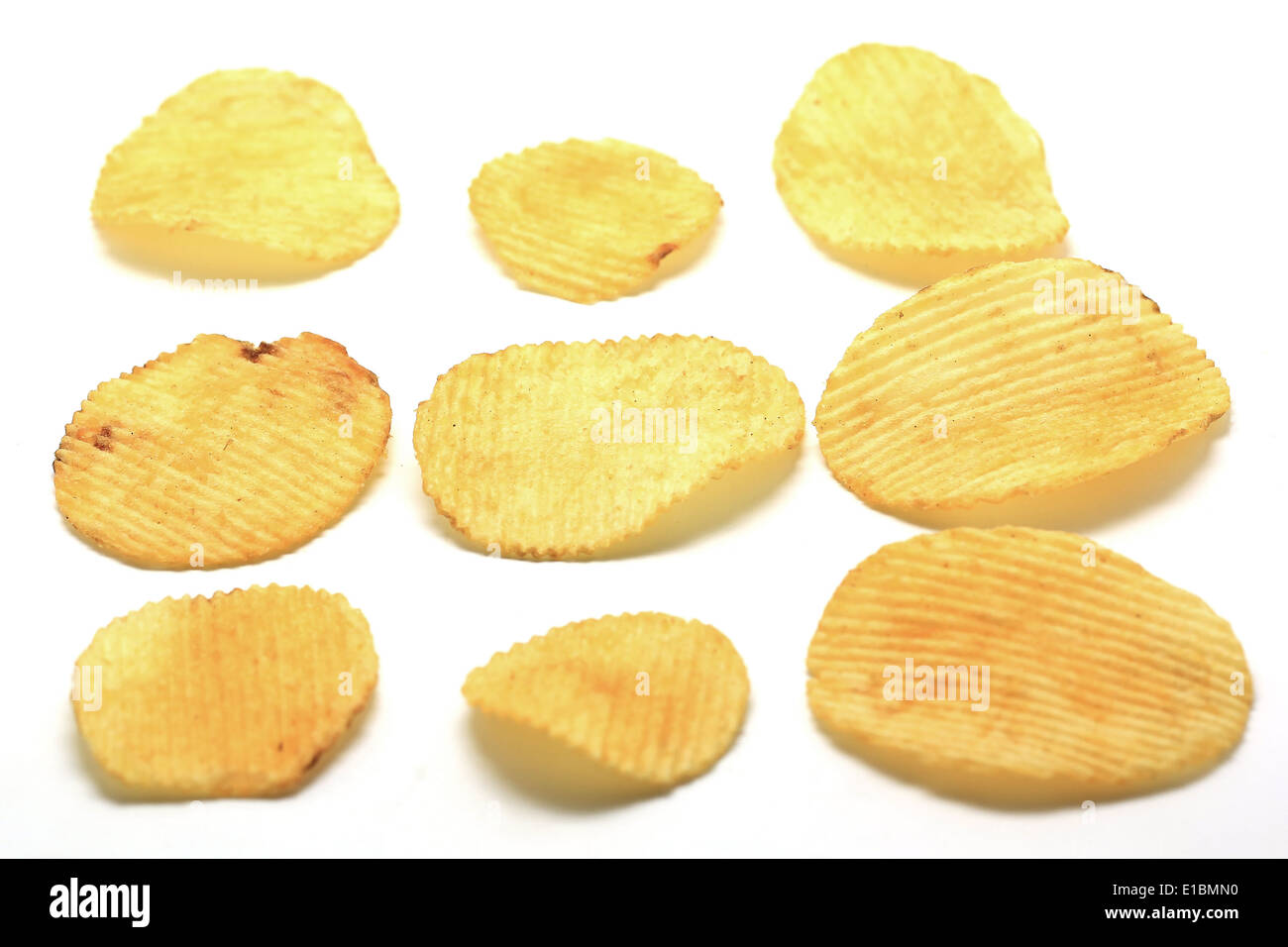 potato crisps isolated on white background Stock Photo - Alamy
