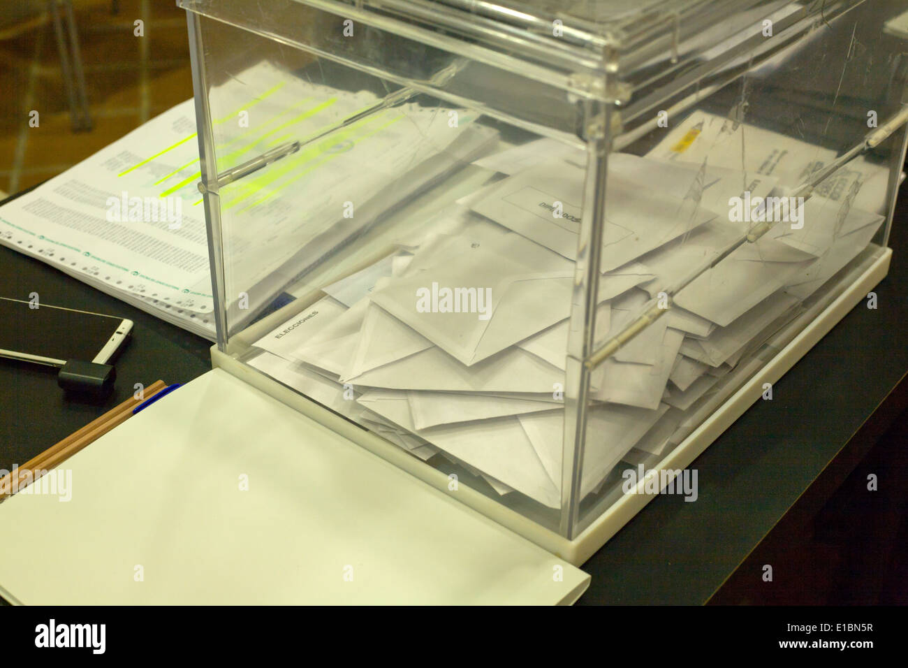 Ballot box with votes made of plexiglass over the election table Stock ...
