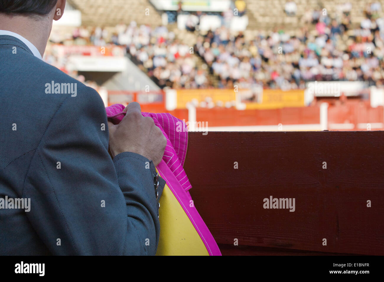 The bullfighter observes the bullring behind the barrier Stock Photo ...
