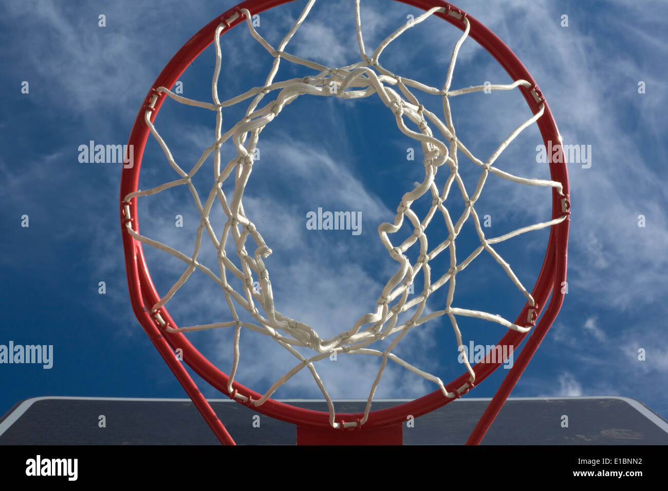 New basketball hoop from below against a cloudy sky Stock Photo - Alamy