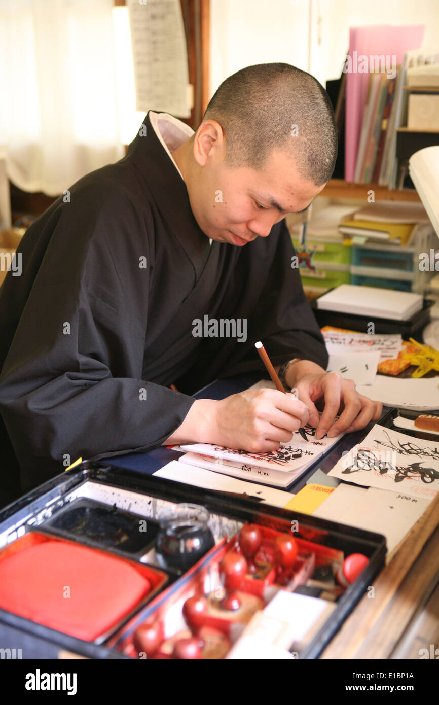 Monk writing temple details into visitors book in Amida-do Hieizan Hiei ...