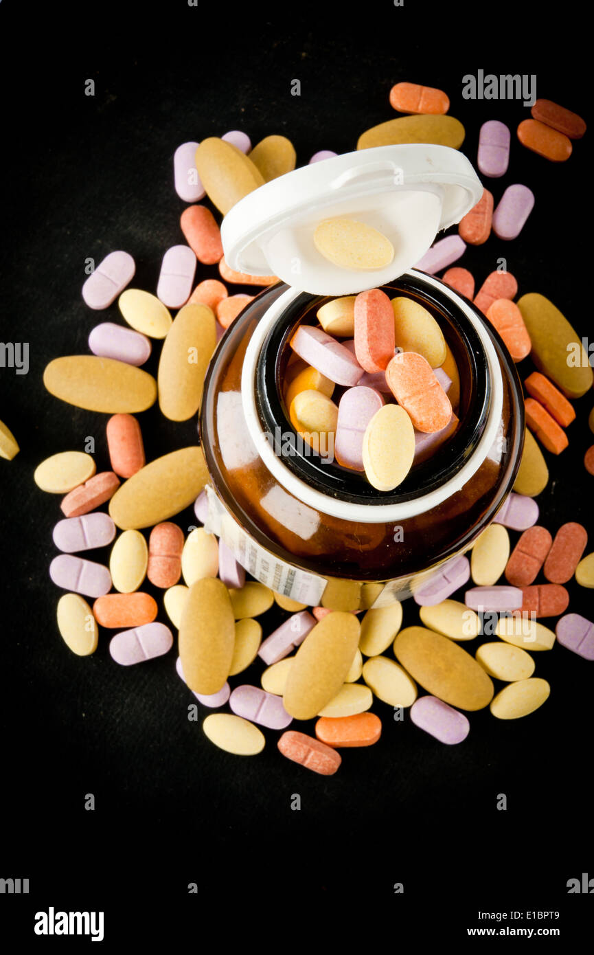 Black red drug pill vitamin hi-res stock photography and images - Alamy