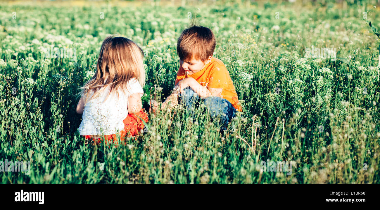 Brother helps sister running away on the road Stock Photo - Alamy