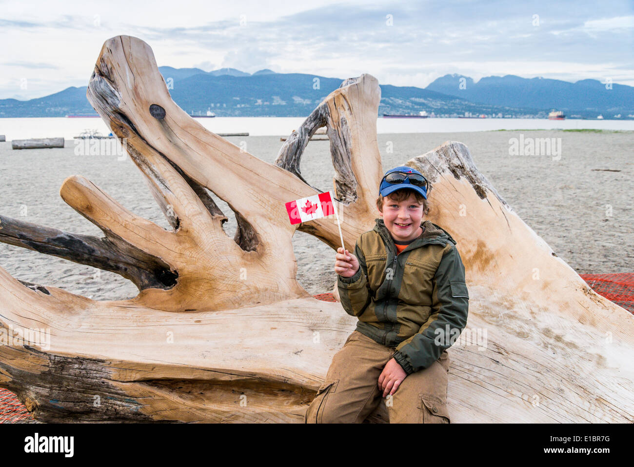Boy with Canadian flag, Spanish Banks beach, Vancouver, British ...