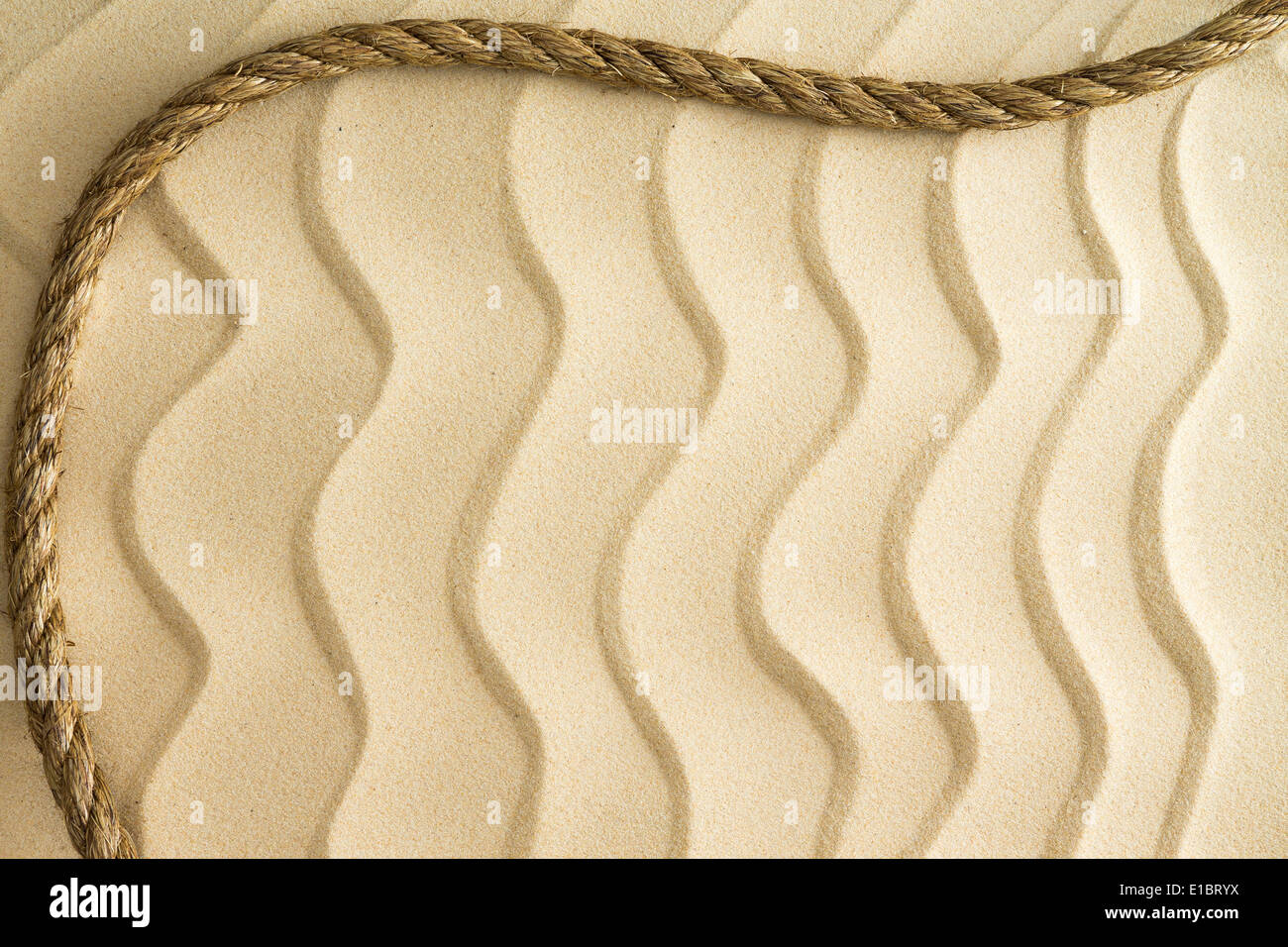 Nautical background of wavy golden beach sand with a ripple effect with ...