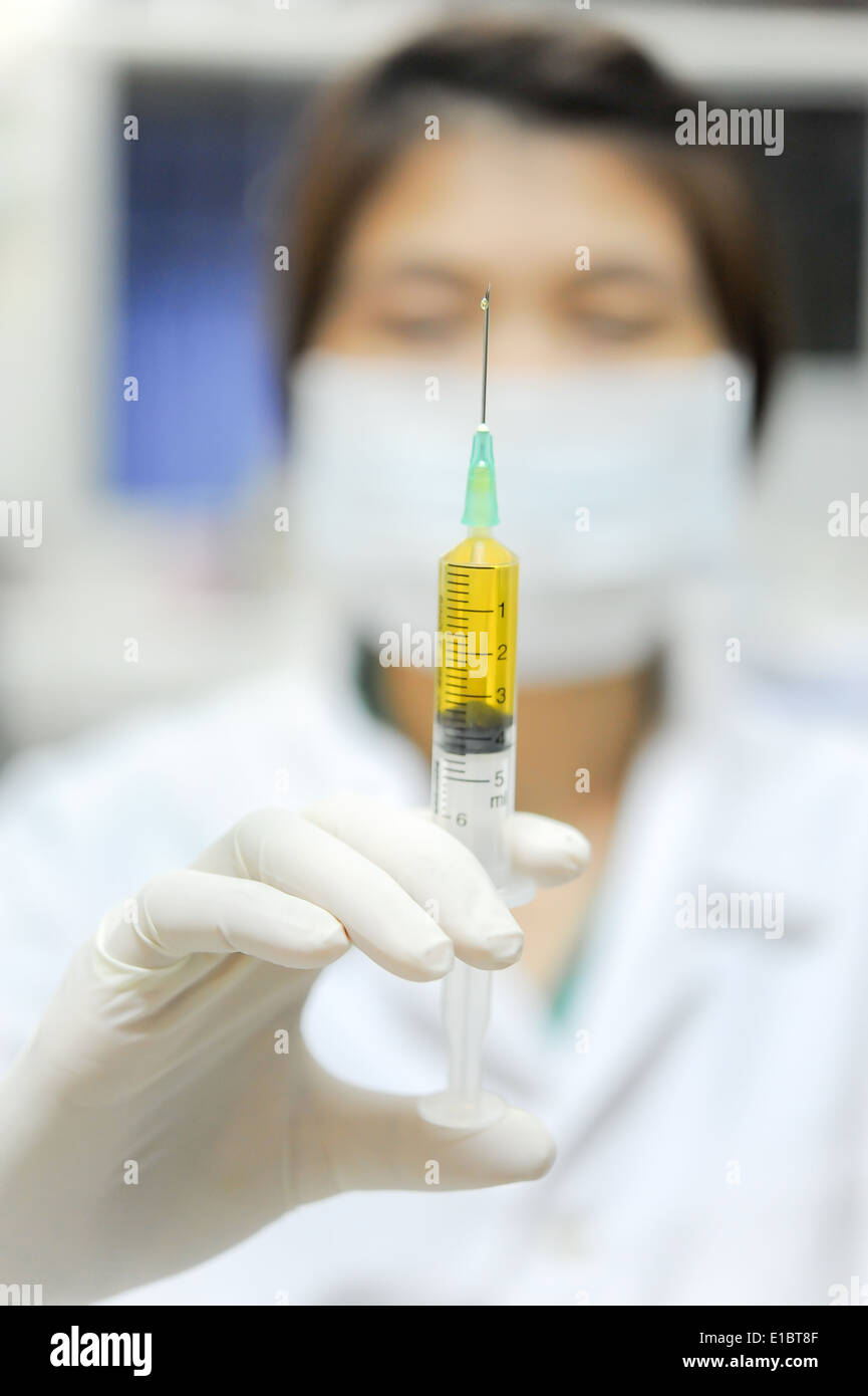 doctor using a syringe Stock Photo - Alamy