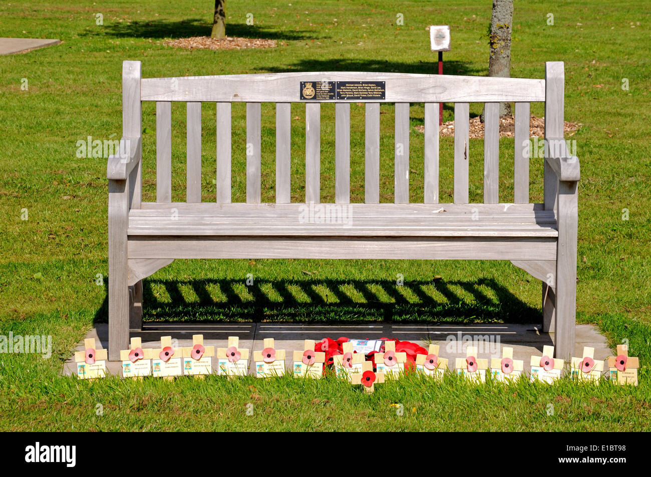 Wooden bench with poppy memorials at the base, National Memorial ...
