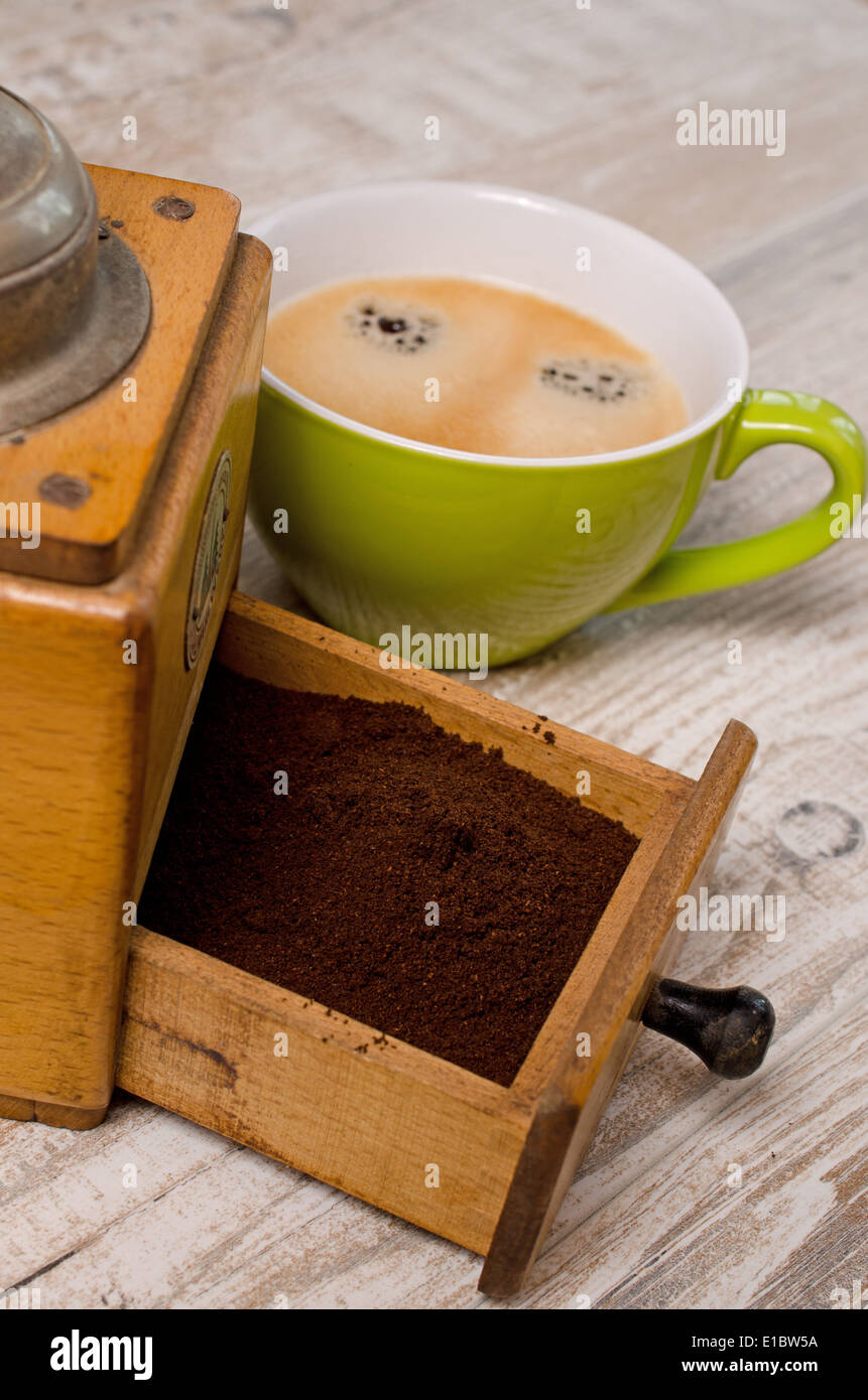 Cup of coffee with a coffee mill Stock Photo - Alamy