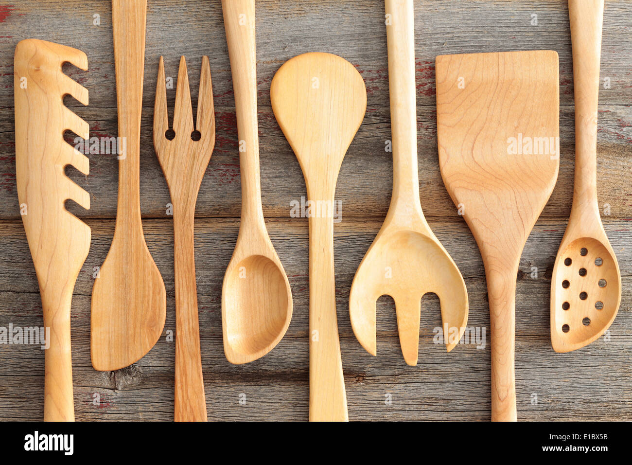 Set of rustic wooden handcrafted kitchen utensils with a spaghetti ...