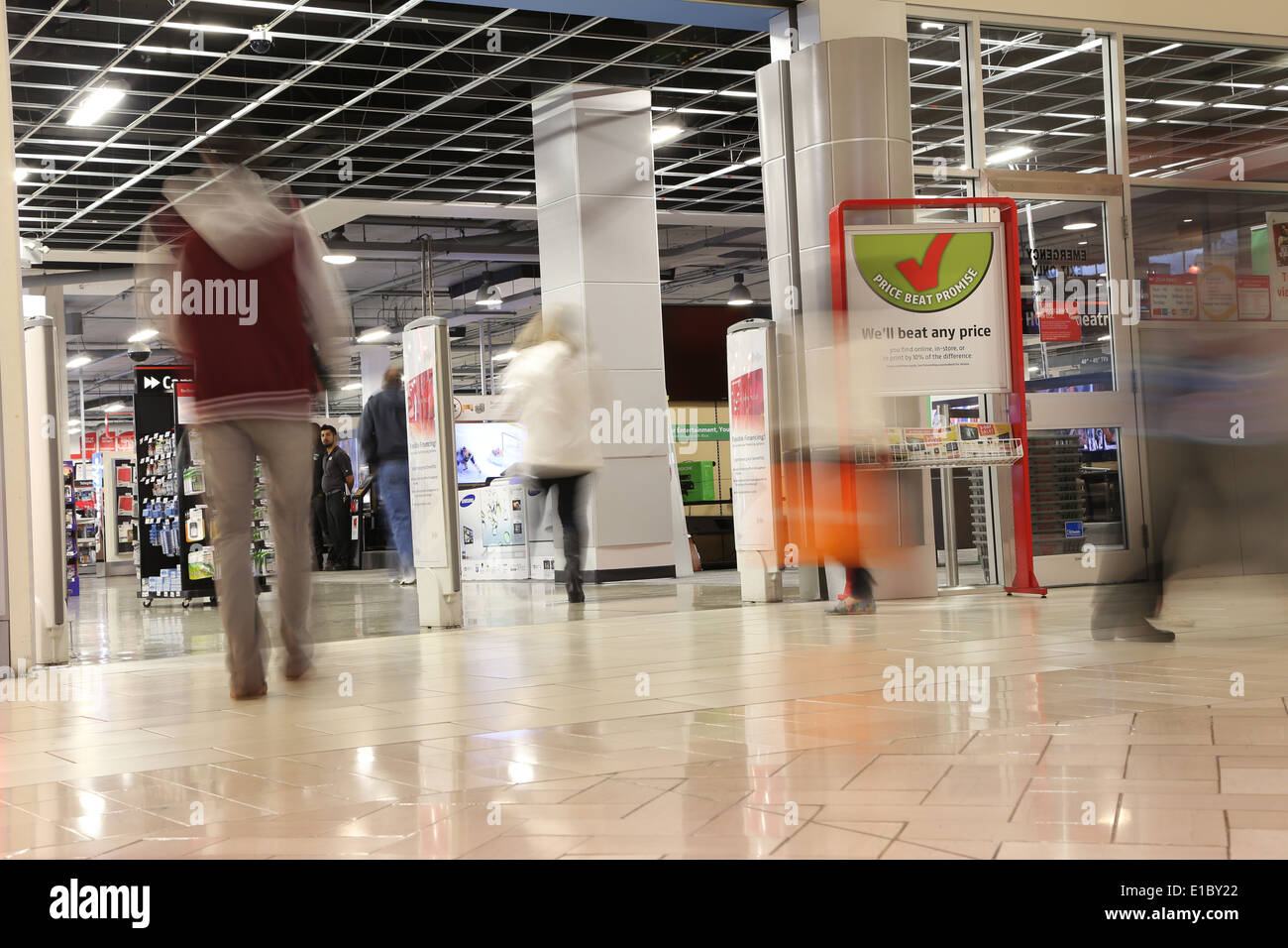 People shopping in future shop store with motion blur Stock Photo - Alamy