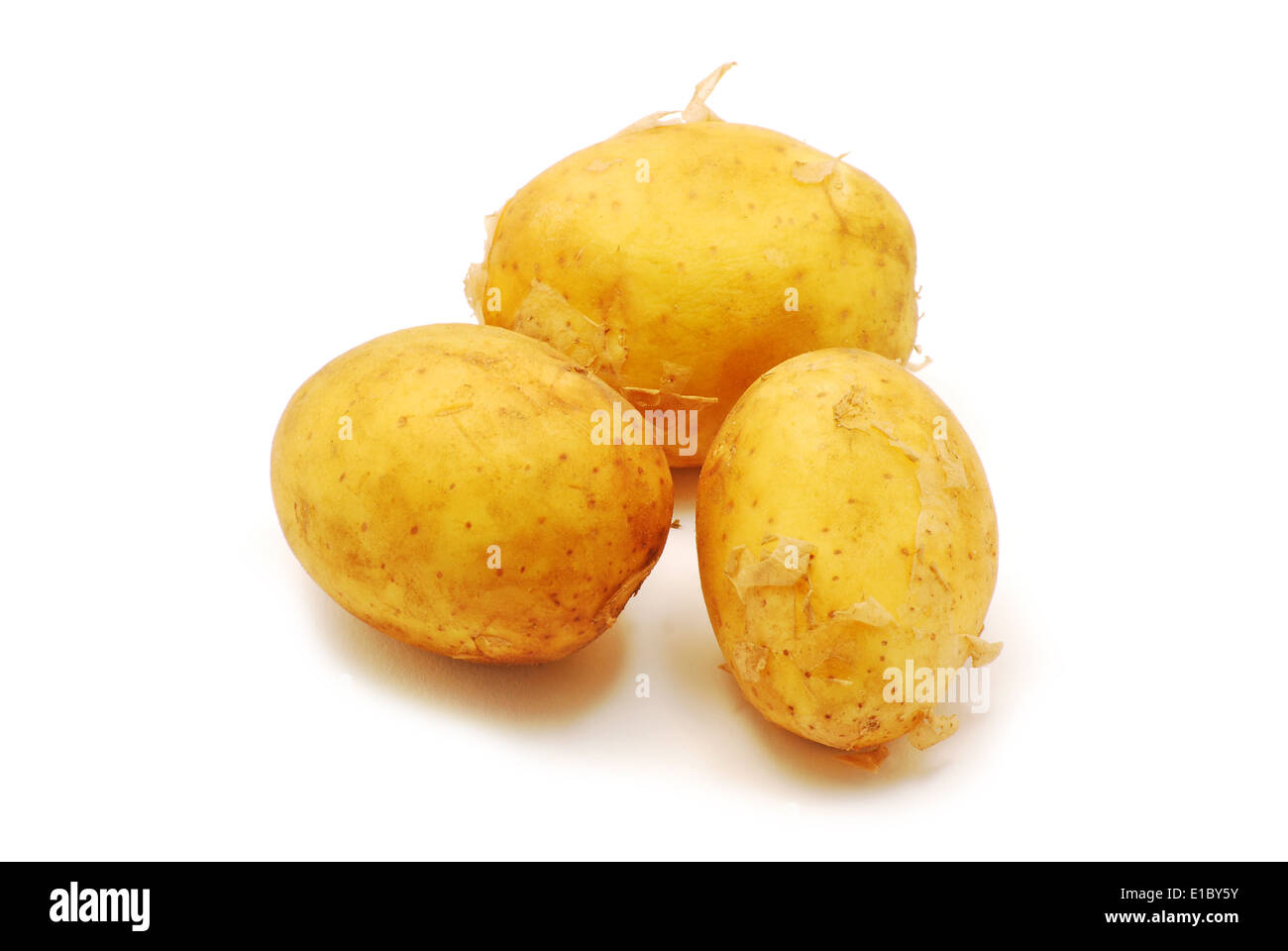 Three potatoes isolated on white background Stock Photo - Alamy