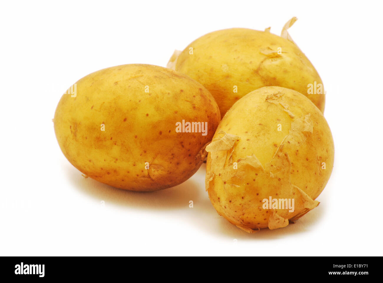 Three potatoes isolated on white background Stock Photo - Alamy