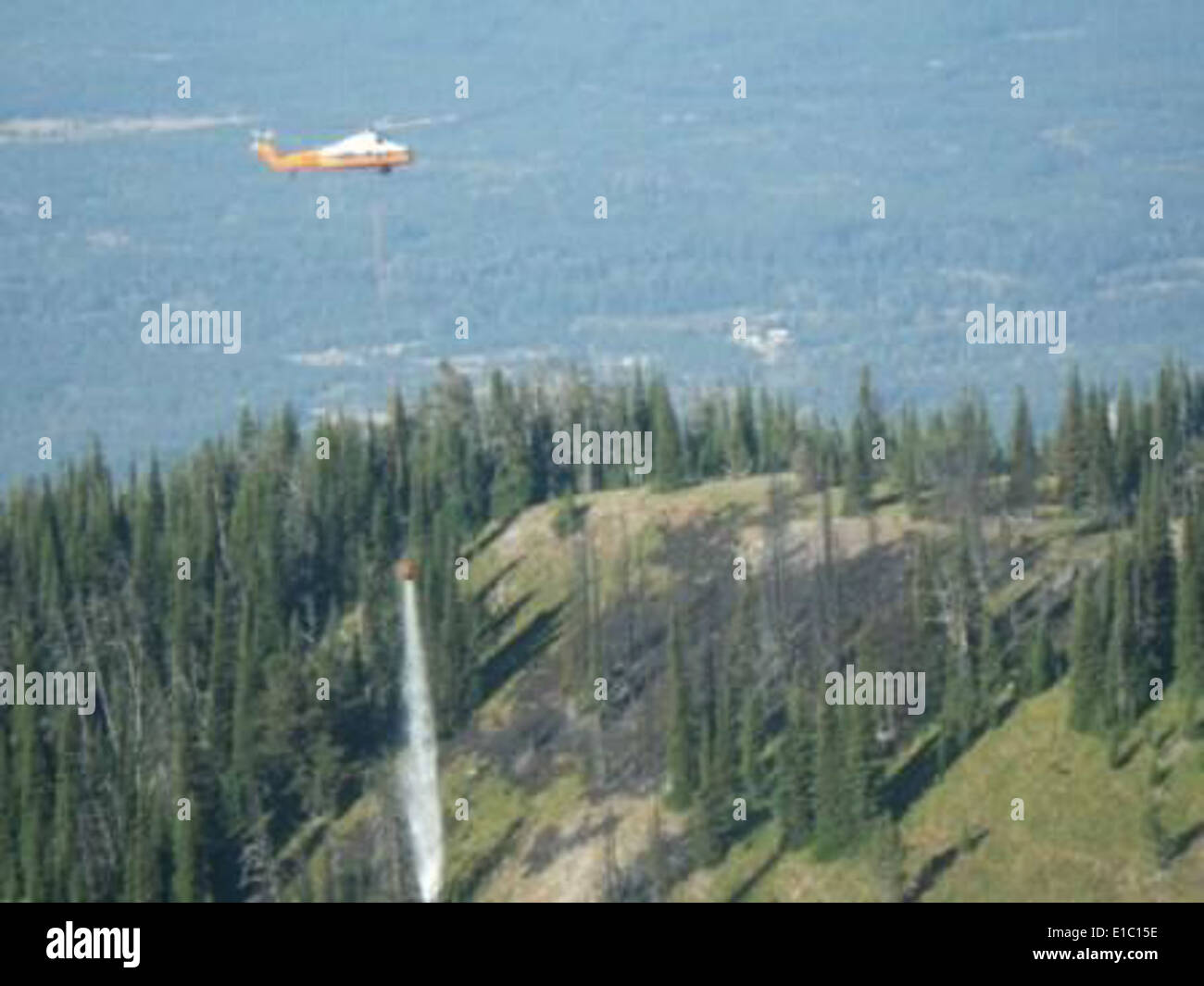 Helicopter performs water drop hi-res stock photography and images - Alamy
