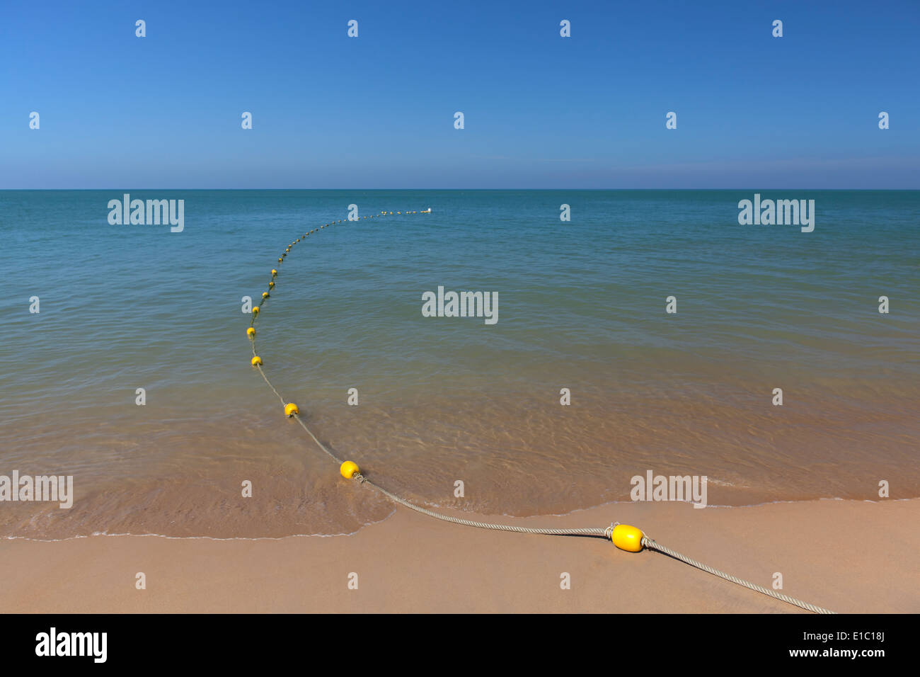 yellow buoy floating on the floating ocean Stock Photo - Alamy