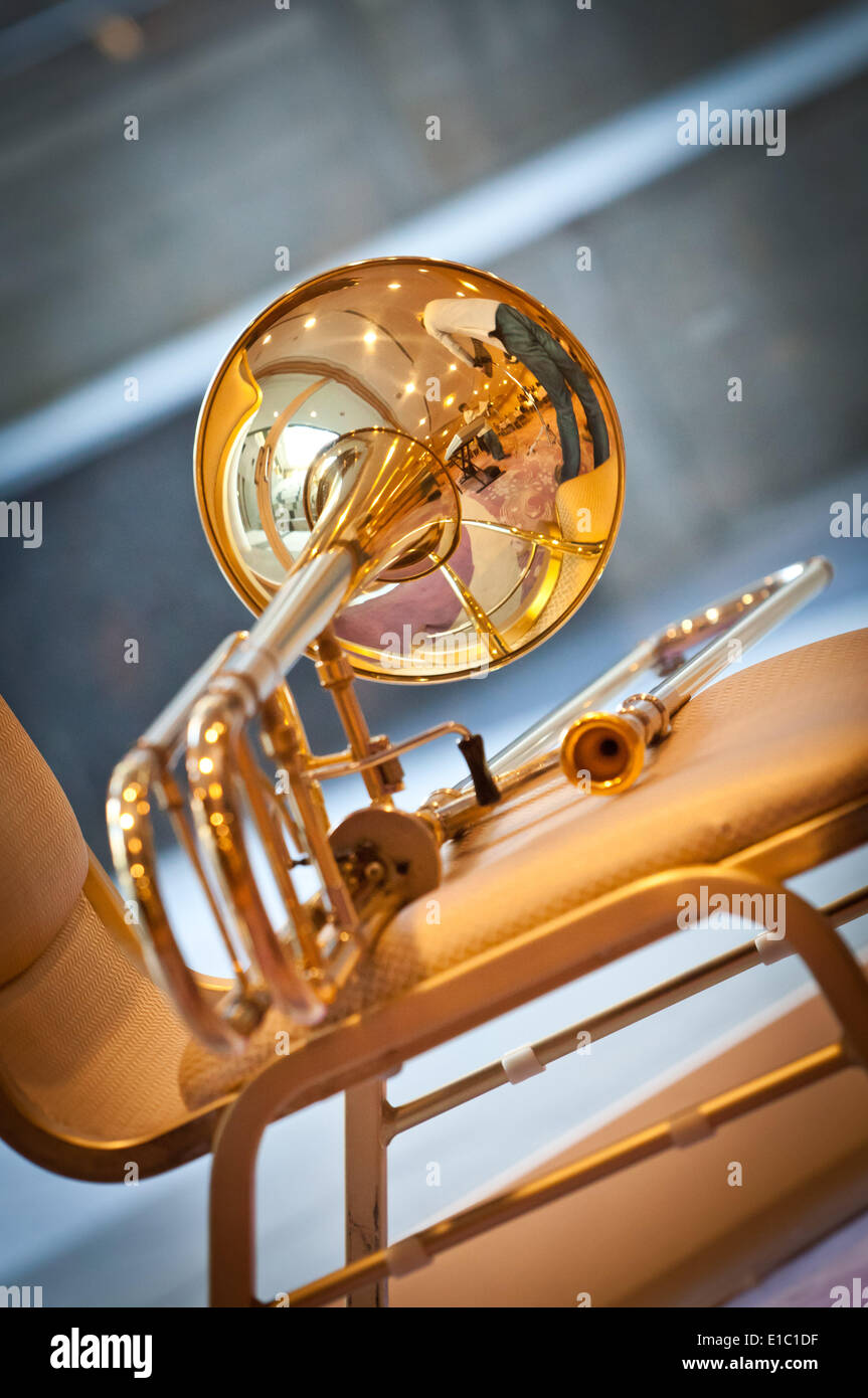 A trombone, sitting on a chair during the musician's break, in May 2013 ...