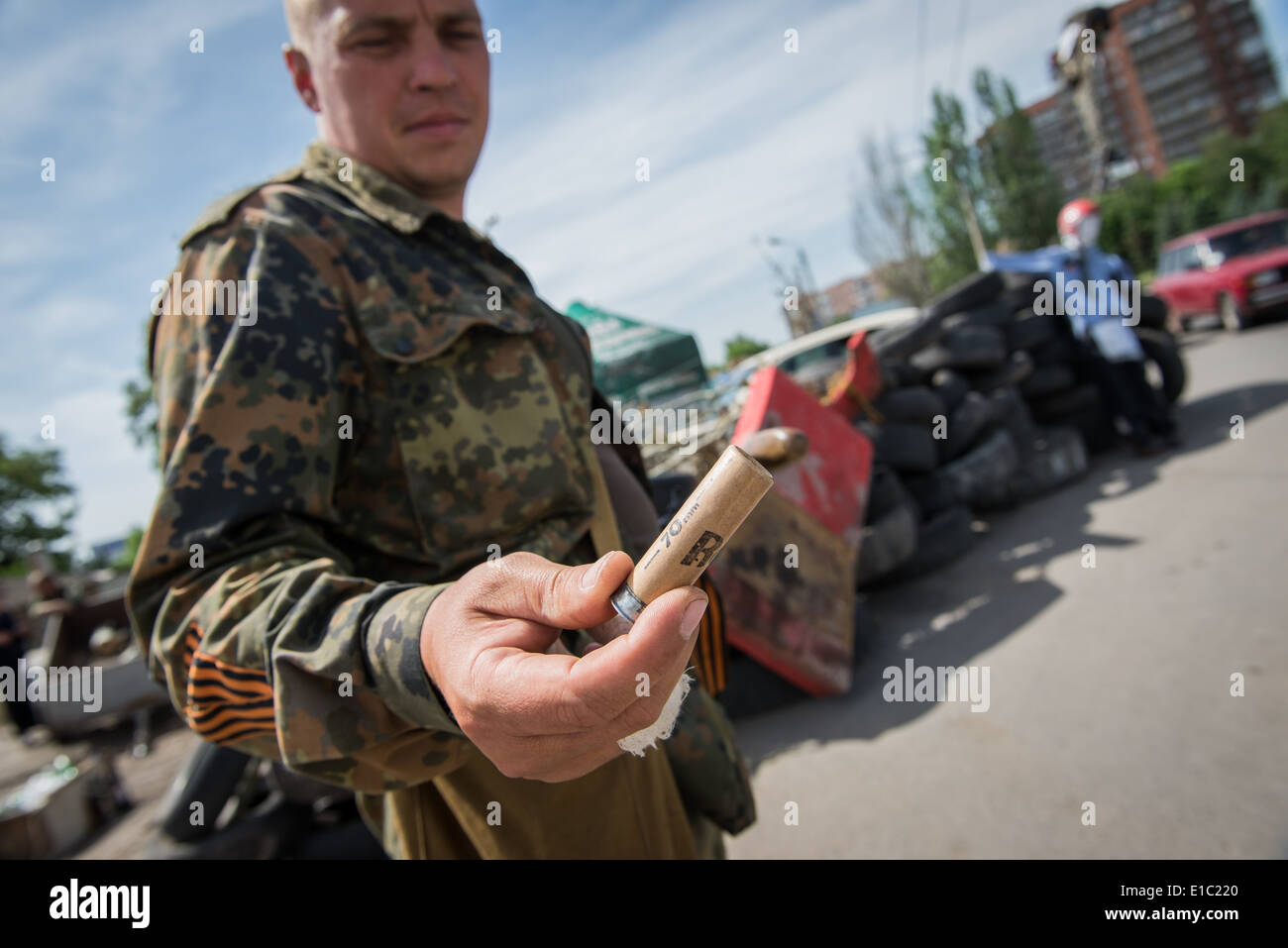 militant showing bullet on Pro-Russian militia checkpoint in Sloviansk ...