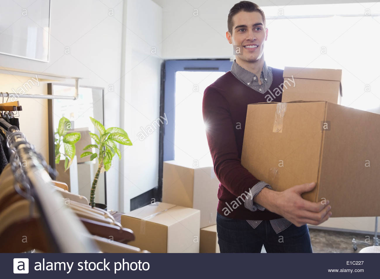 Carrying boxes hi-res stock photography and images - Alamy