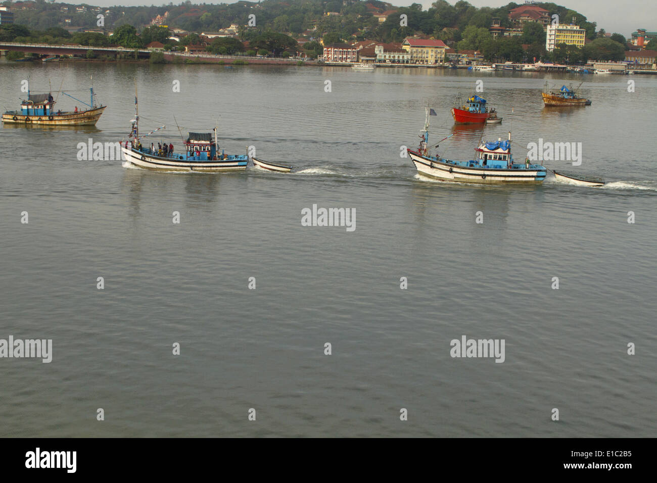 Trawlers appraoch Malim Jetty with fish catch in North Goa, India Stock ...