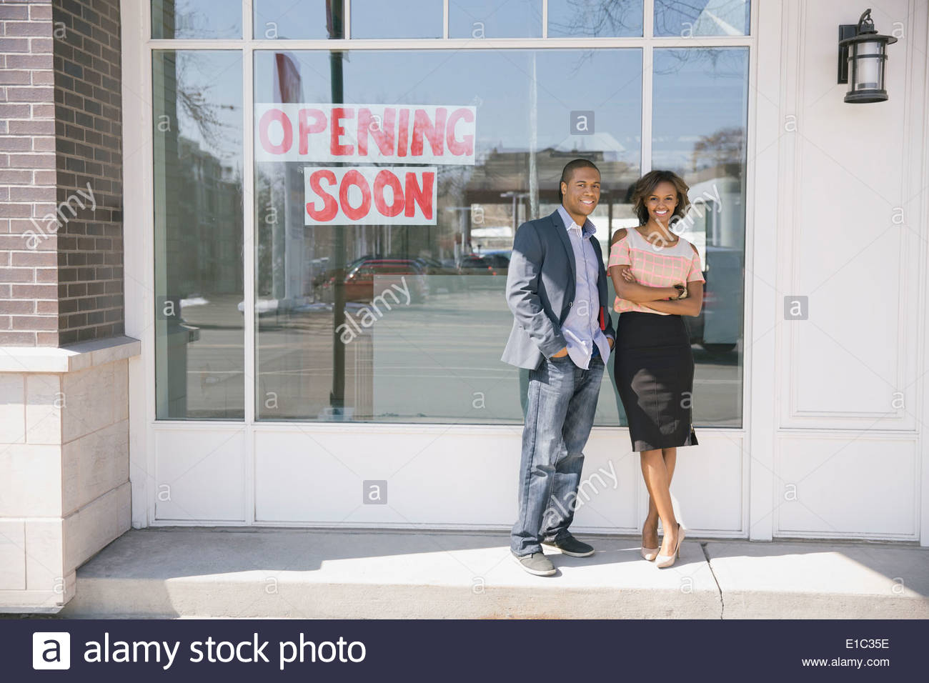 Portrait of business owners at new storefront Stock Photo - Alamy
