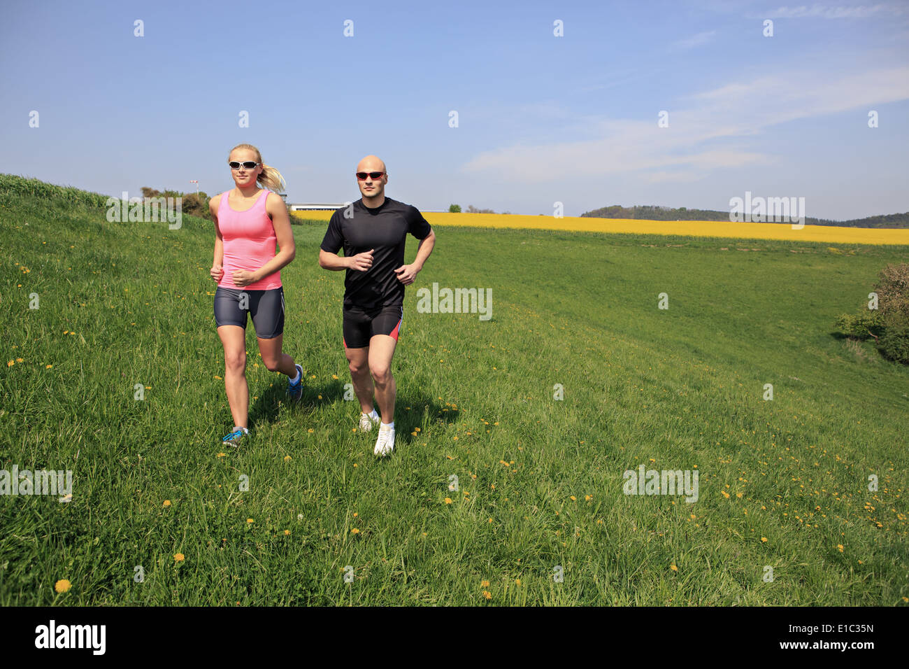 Woman running through field hi-res stock photography and images - Alamy