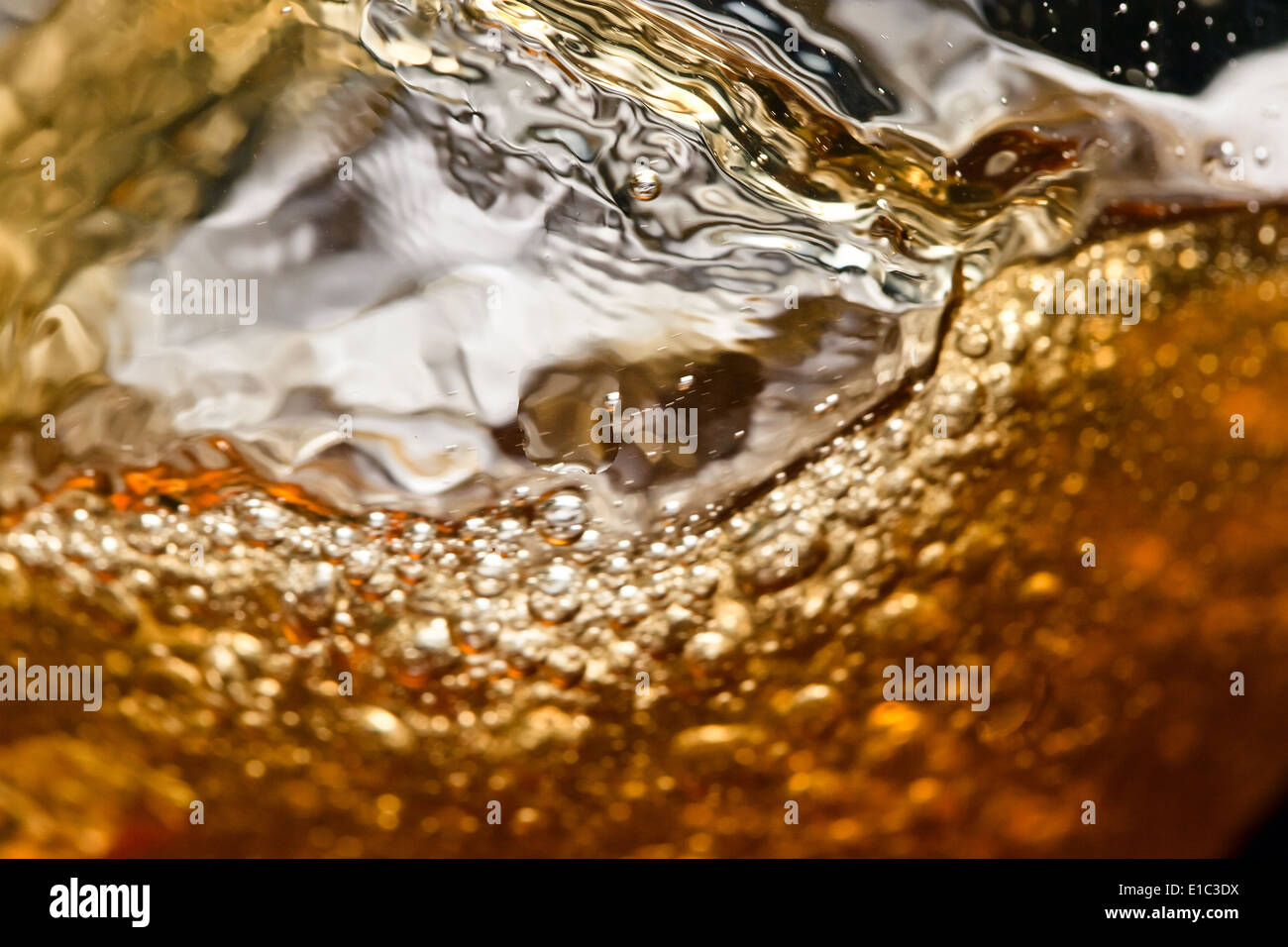 detail of an alcoholic beverage on black background Stock Photo - Alamy