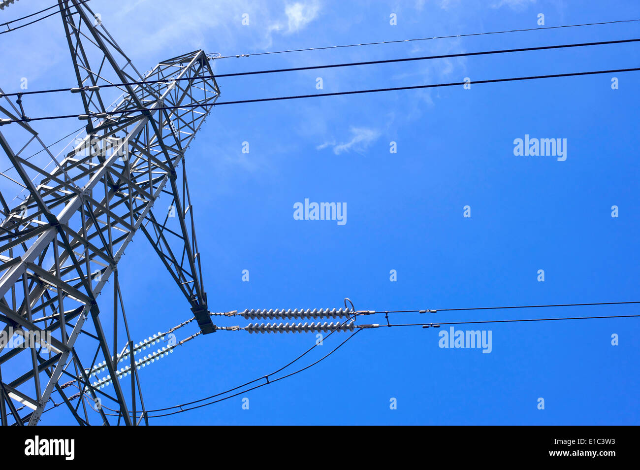 Overhead electricity pylons against the sky Stock Photo - Alamy