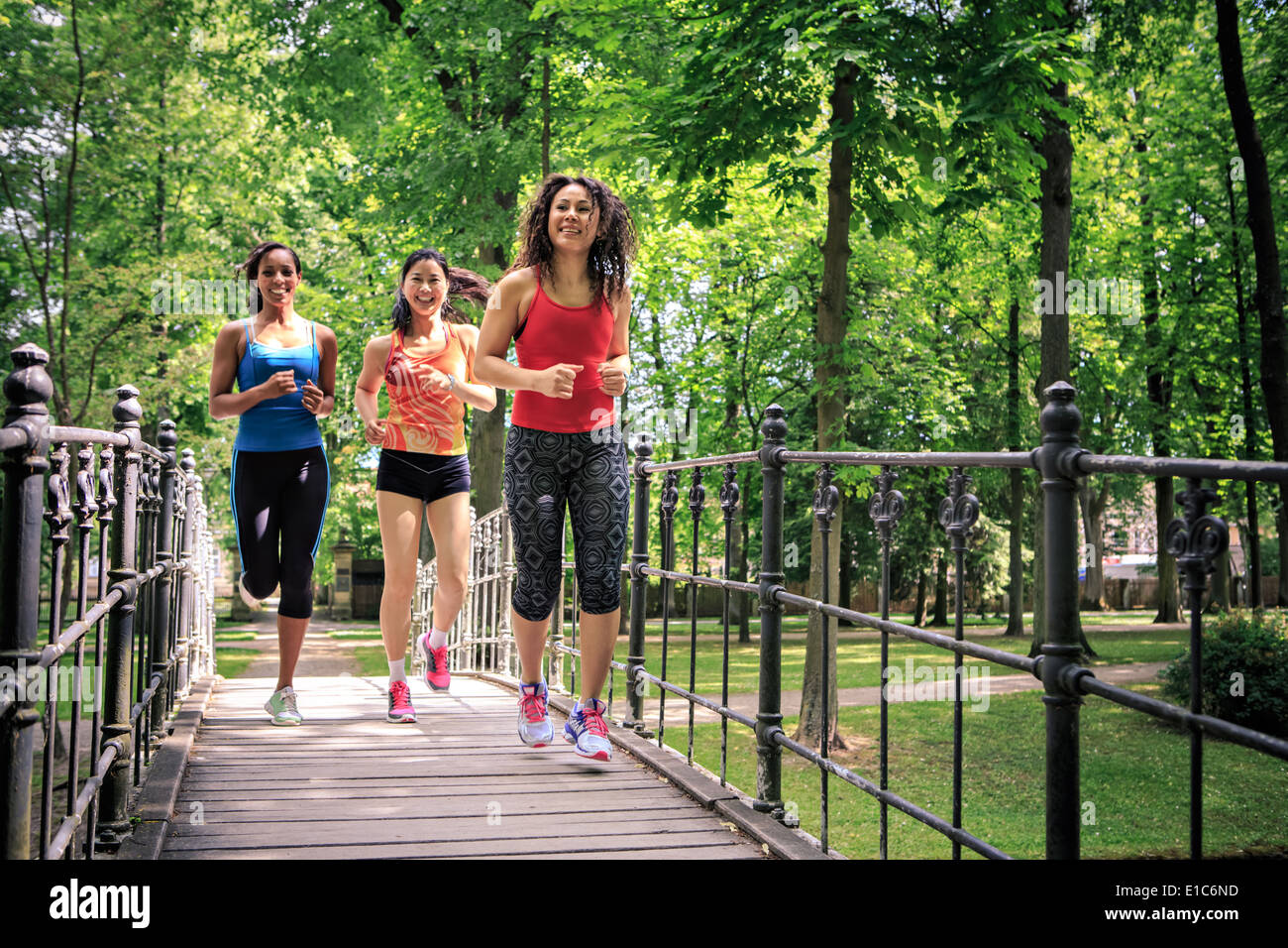 group of women jogging by a river in the old city park Stock Photo - Alamy