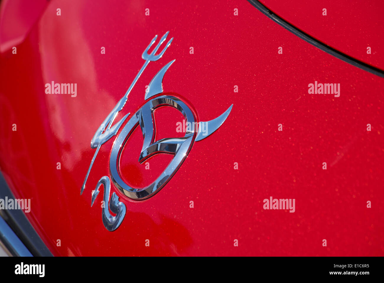 modified car badge on bonnet hood of red Mazda car Stock Photo - Alamy