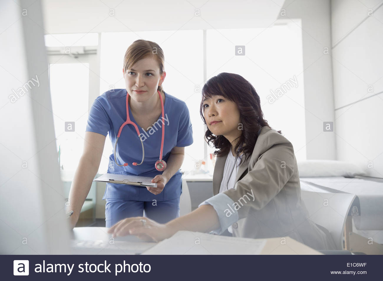 Doctor and nurse reviewing medical chart in clinic Stock Photo - Alamy Doctor and nurse reviewing medical chart in clinic Stock Photo - Alamy