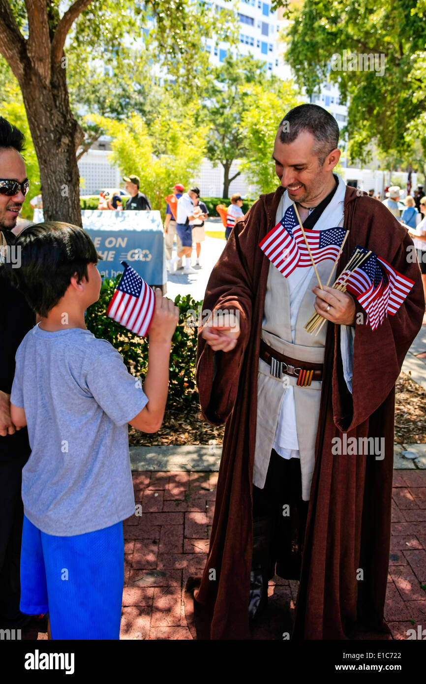 Star Wars Jedi Warrior handing out flags at an event in downtown ...