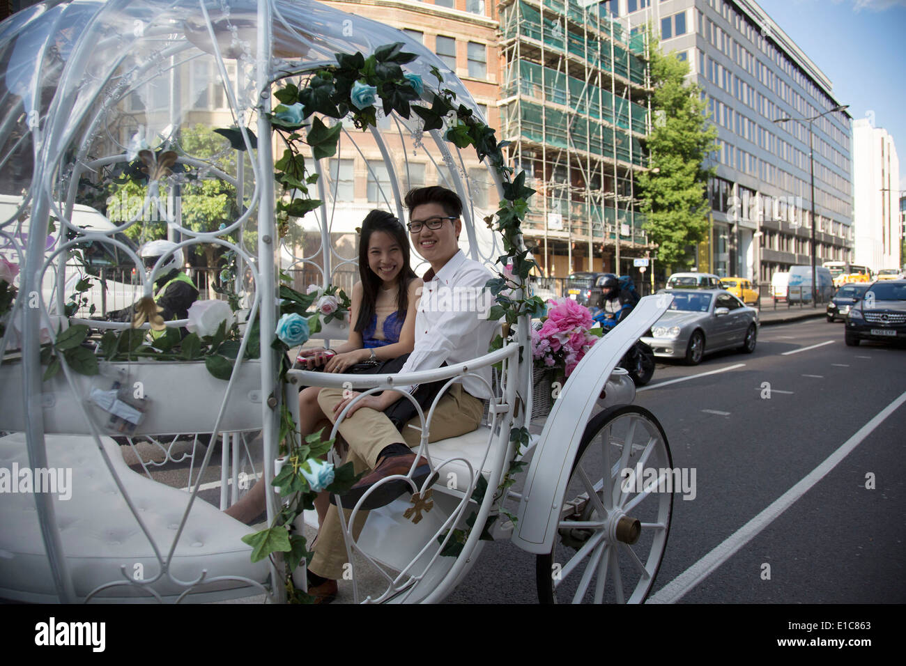 Chinese wedding couple in a horse drawn Cinderella carriage on Lower ...