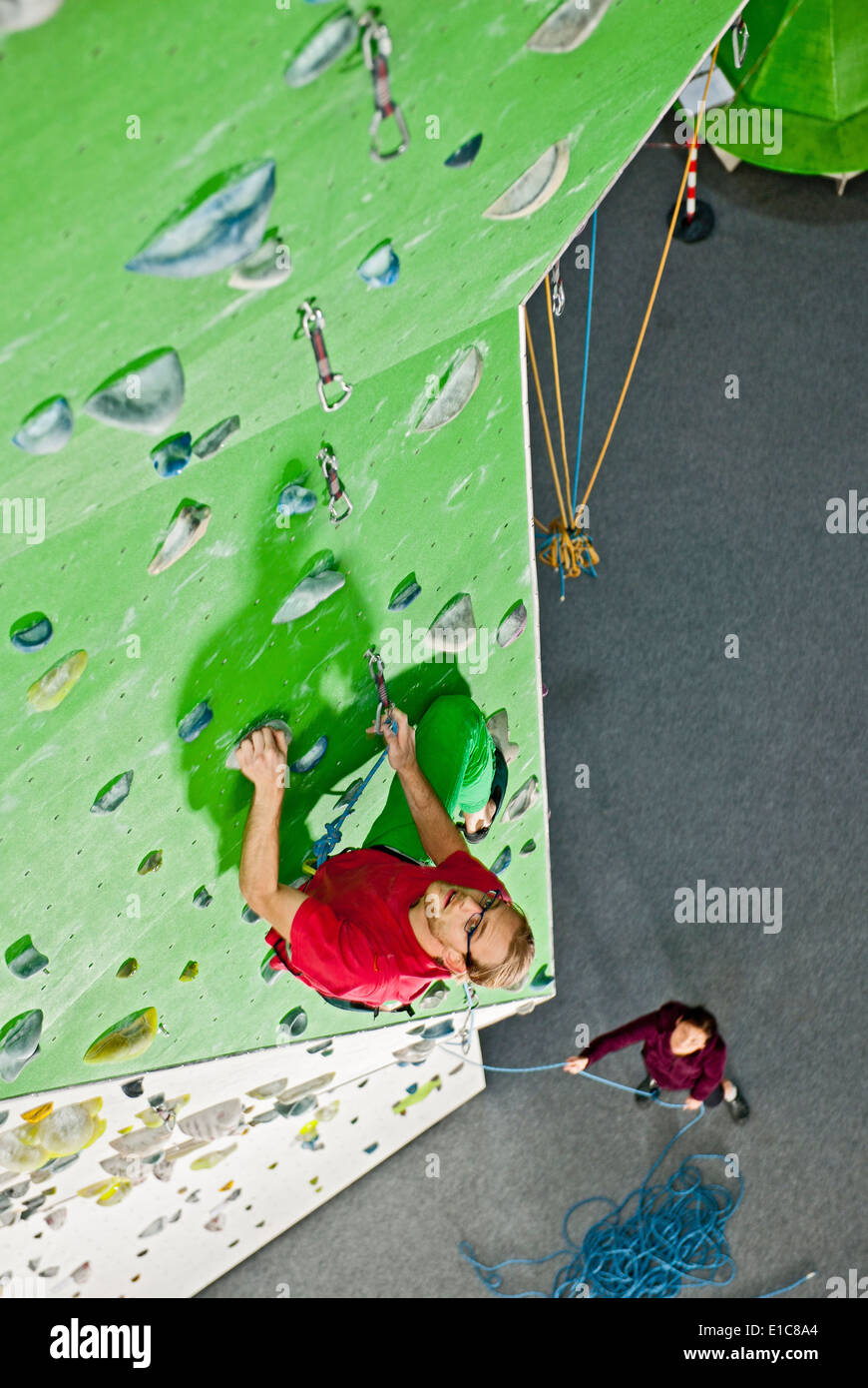 Man climbing at at indoor climbing centre Stock Photo - Alamy