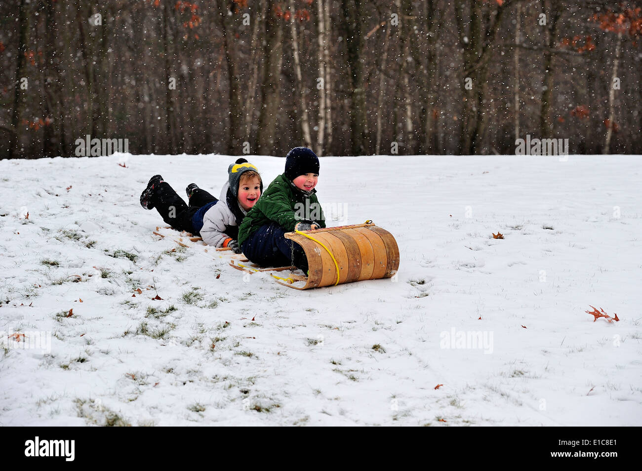 Children boys on sled hi-res stock photography and images - Alamy