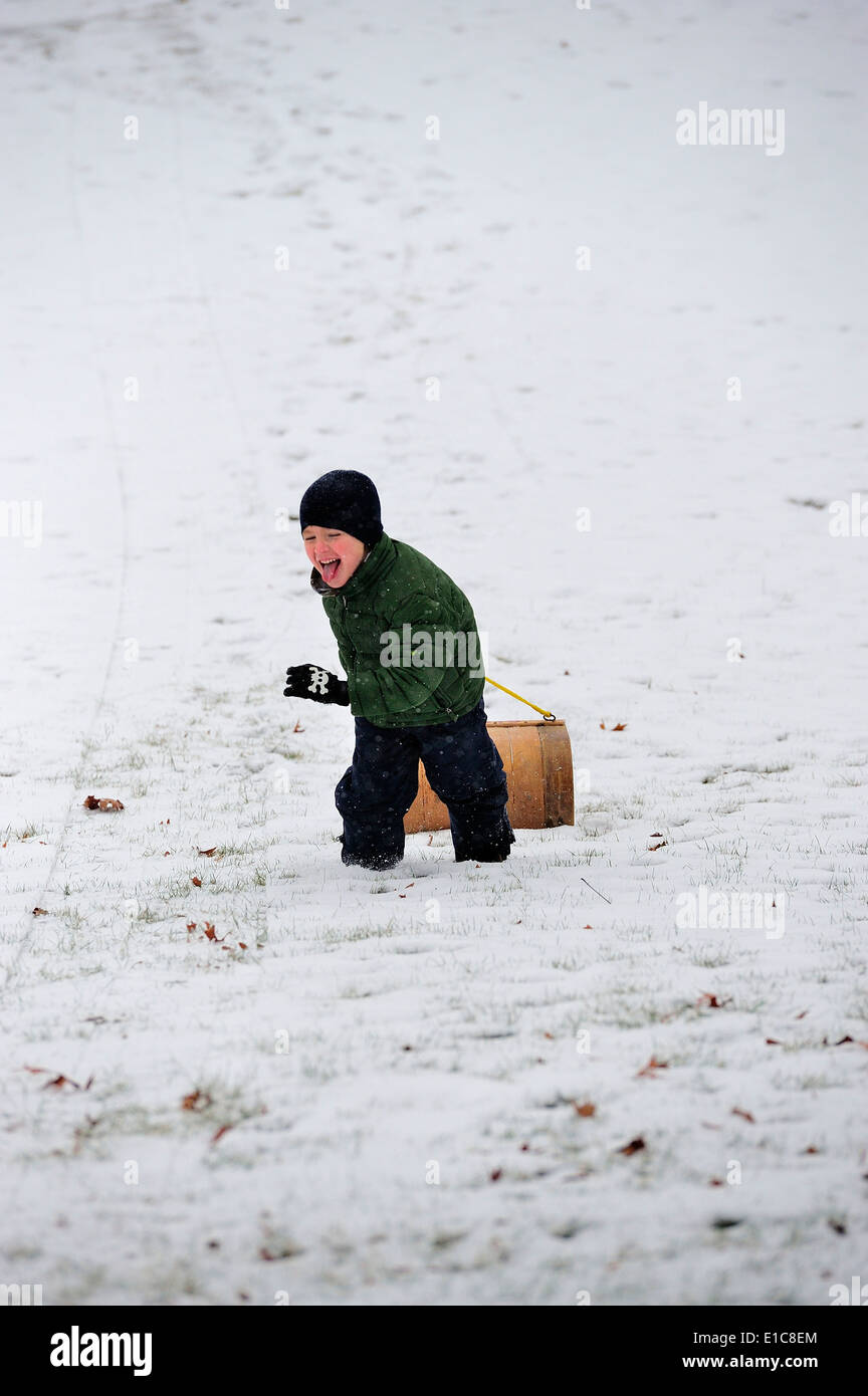 Boy sled riding hi-res stock photography and images - Alamy