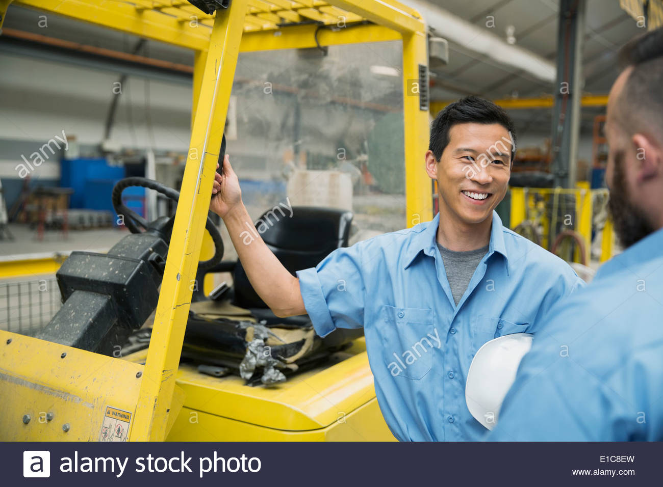 Happy men in factory hi-res stock photography and images - Alamy