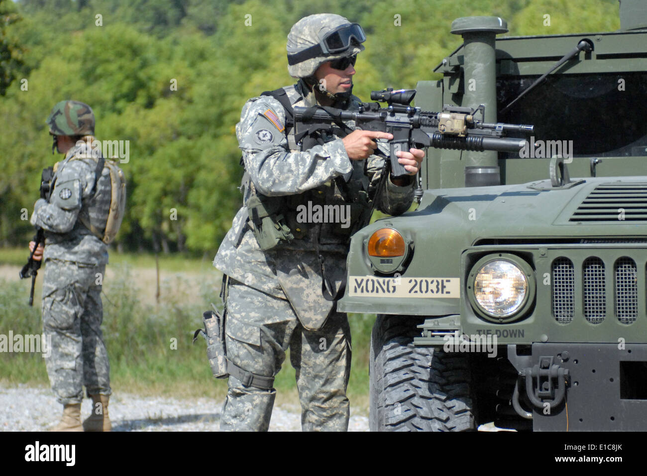 U.S. Army Staff Sgt. Tyler King provides security during vehicle ...
