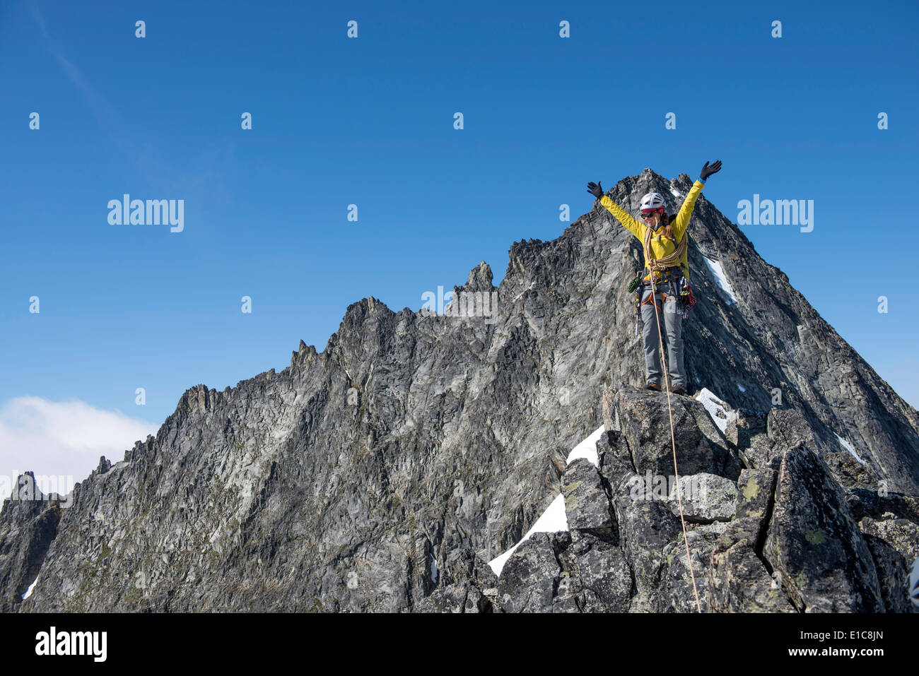 Woman climbing on the North Ridge of Forbidden Peak in North Cascades ...